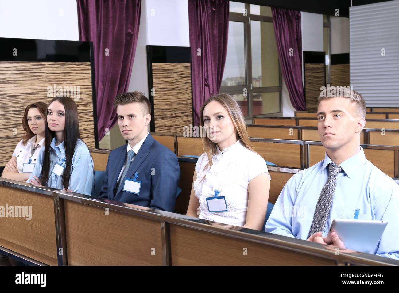 Audience listening to presentation at conference Stock Photo - Alamy