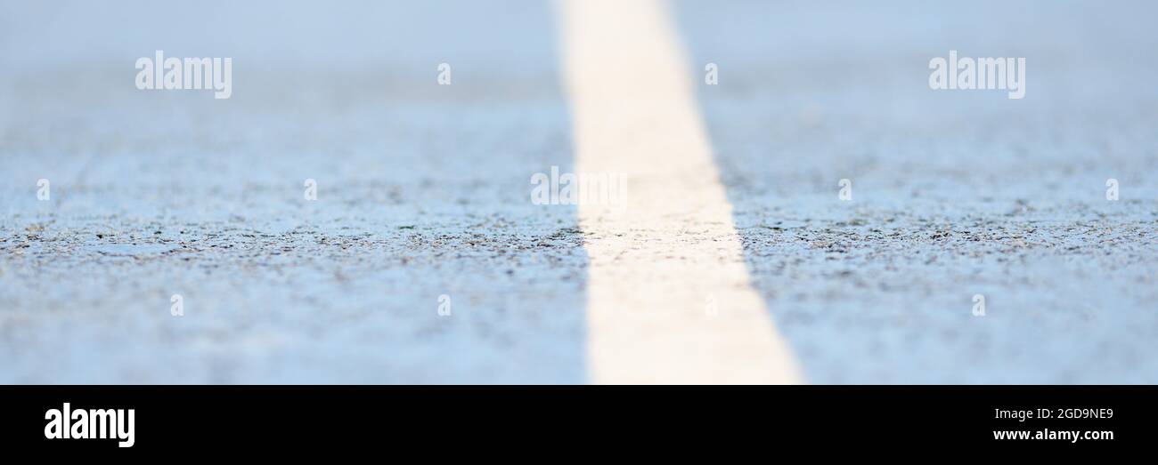 Closeup of white dividing strip on road Stock Photo - Alamy