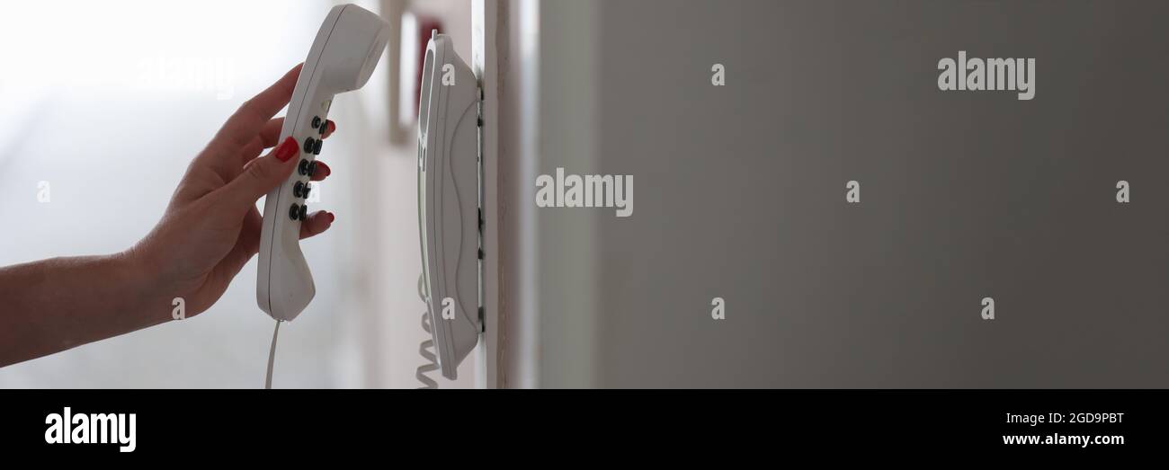 Hand picking up telephone hi-res stock photography and images - Alamy