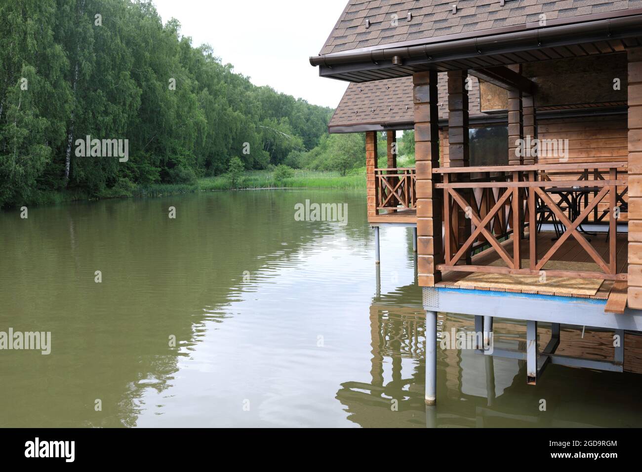 Wooden house on shore of pond in Moscow region, Russia Stock Photo - Alamy