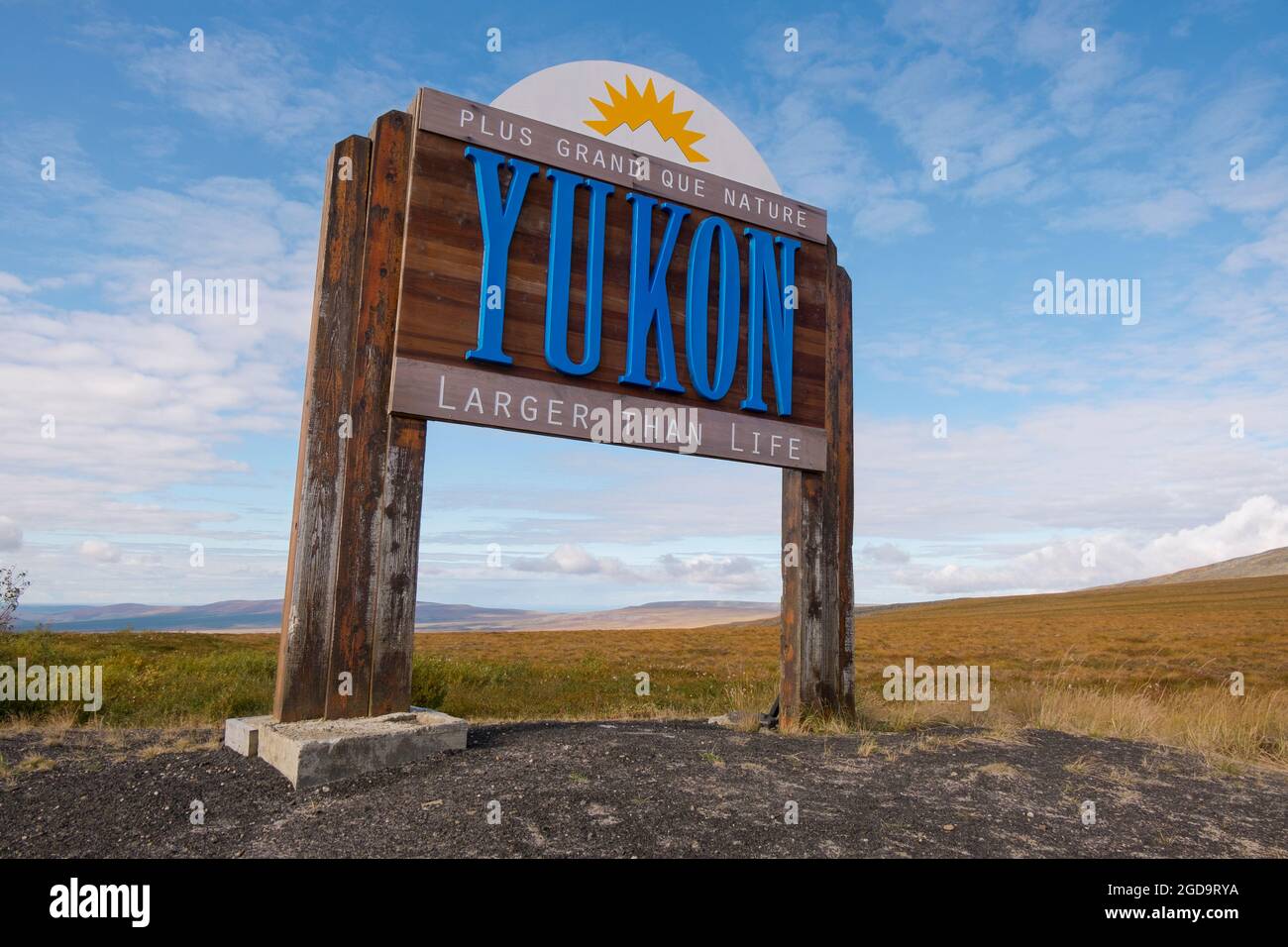 The Yukon territory wood sign on a bright, sunny, blue sky day. The ...