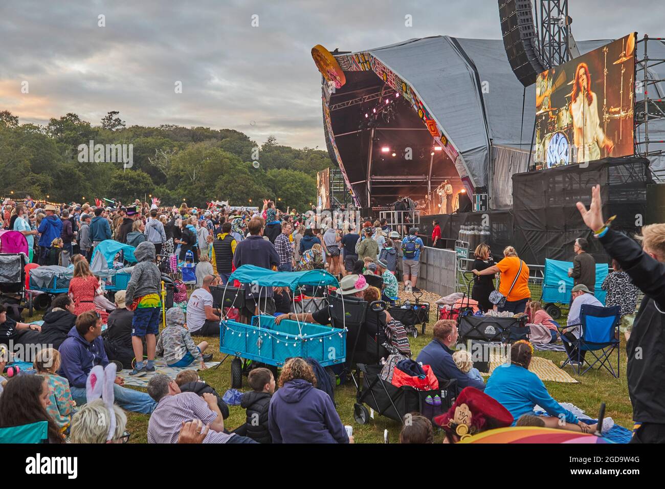 A dusk view of crowds of spectators in front of the main stage at Camp ...
