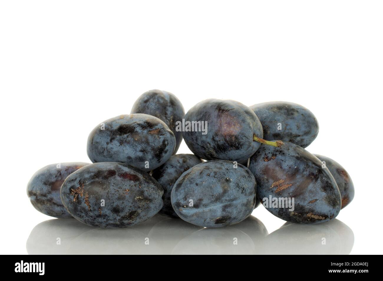 Several ripe organic Damson plums, close-up, isolated on white Stock ...