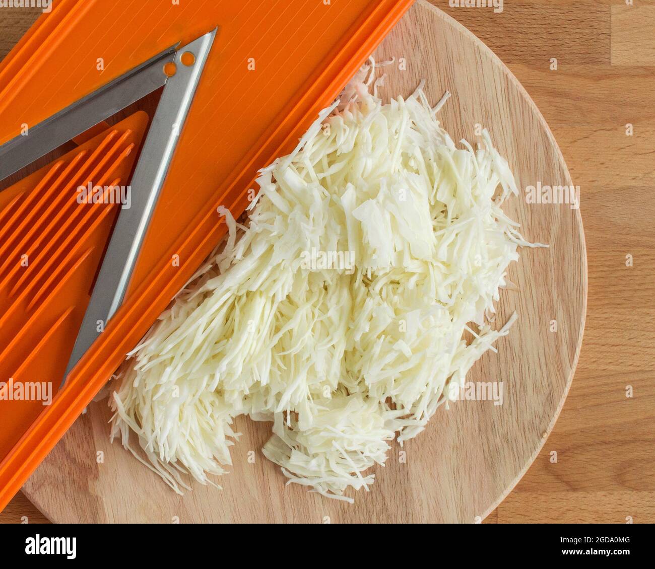 White cabbage finely chopped with a special knife Stock Photo - Alamy