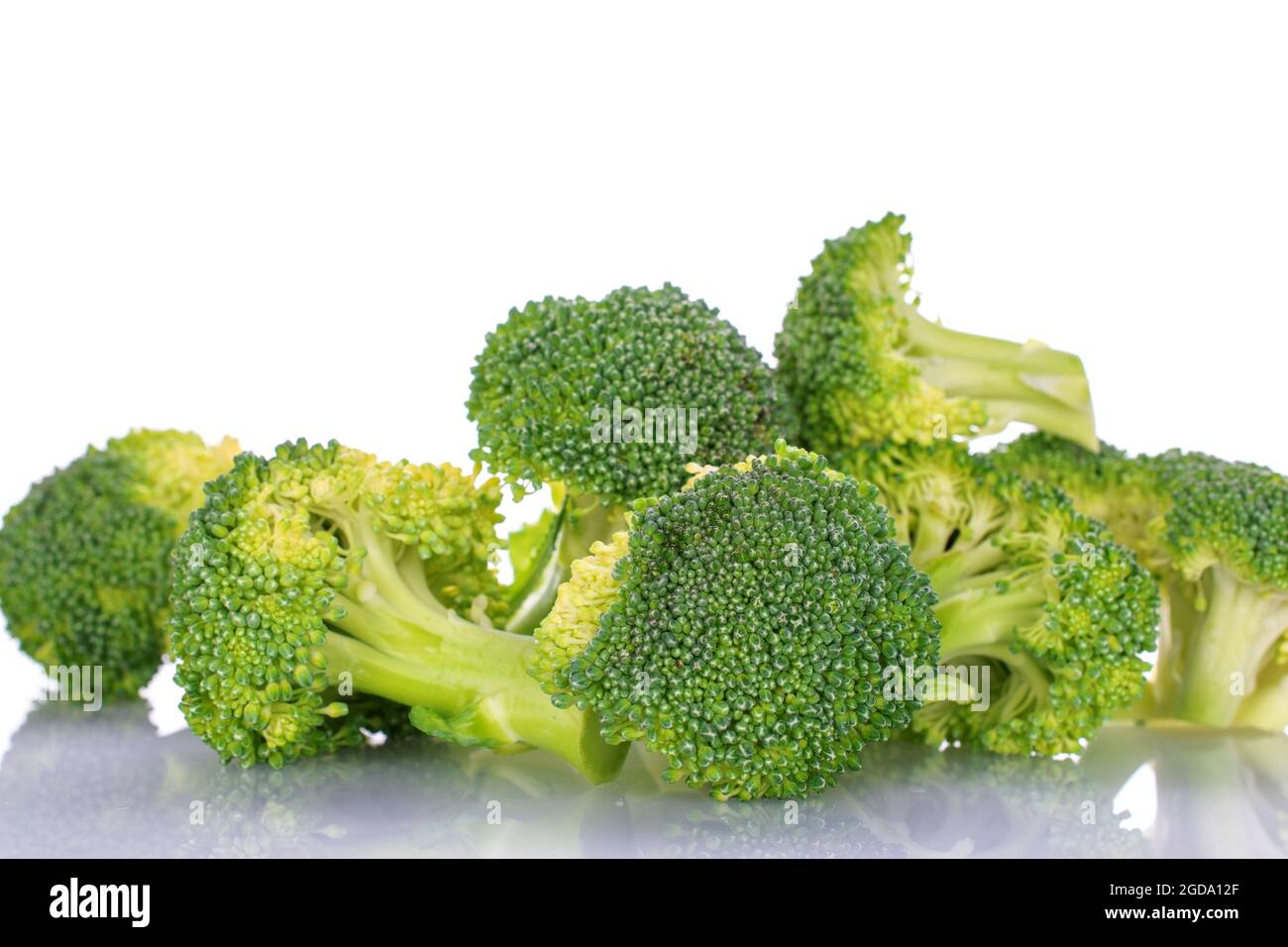 Green not cooked broccoli, close-up, on a white background Stock Photo ...