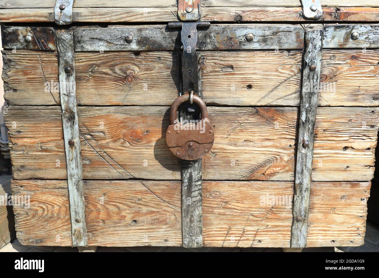 Details of wooden chest with rusty lock Stock Photo - Alamy