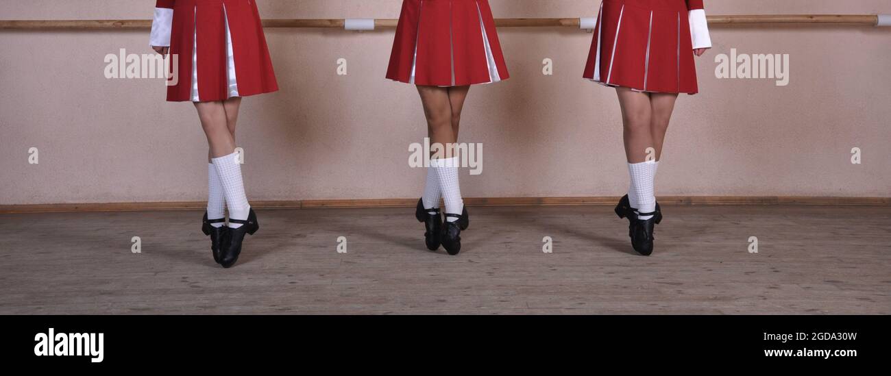 Close-up of a group of woman dancing traditional Irish dances. Legs of ...