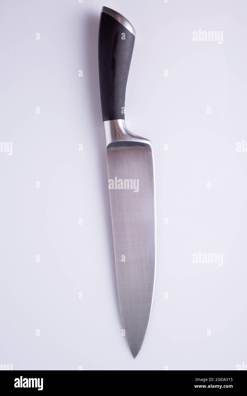 steel kitchen knife on a white background, top view Stock Photo - Alamy