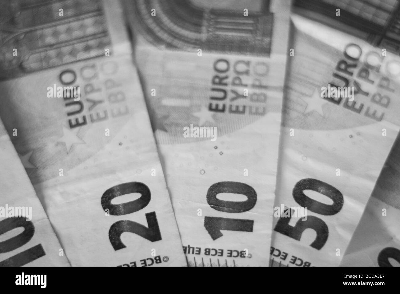 Euro banknotes. table covered with banknotes Stock Photo - Alamy