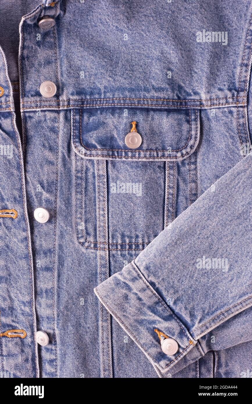 A close-up photo of one element of a common denim jacket Stock Photo ...