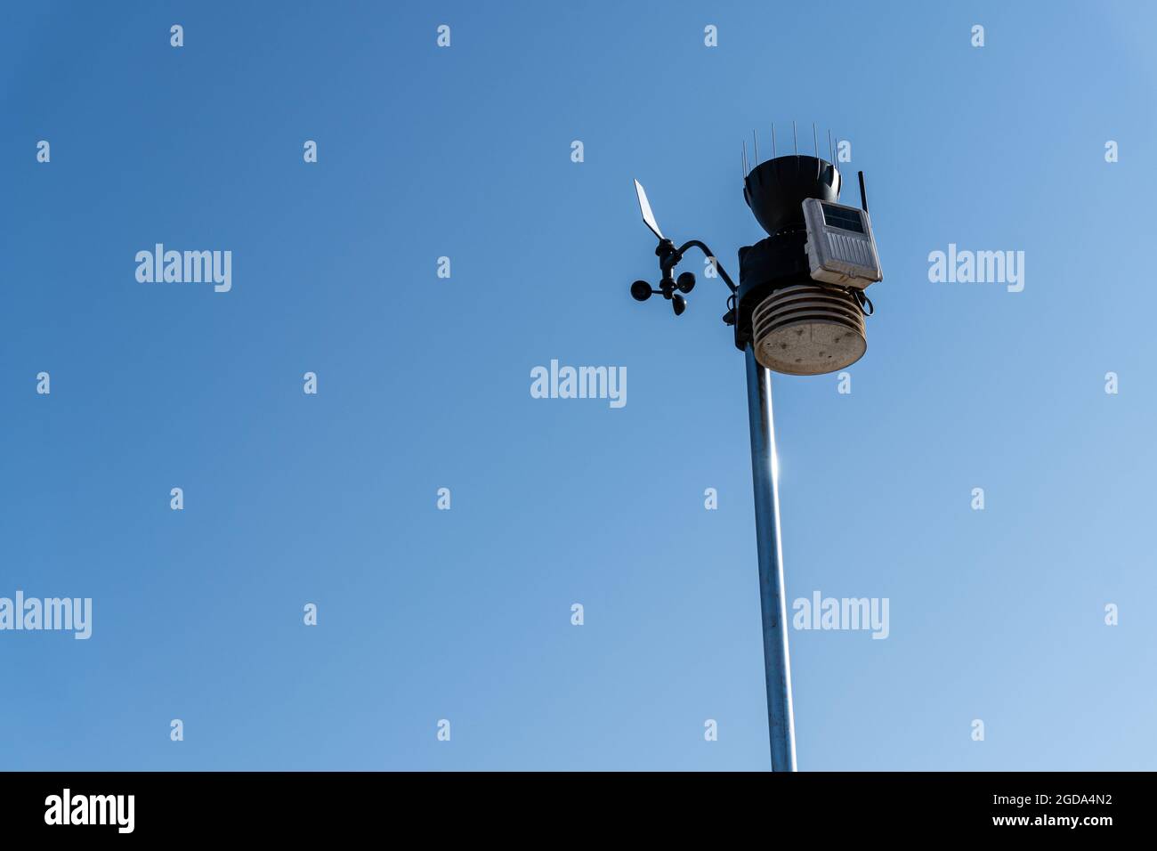 Tall weather station outdoors on a blue sky background Stock Photo - Alamy