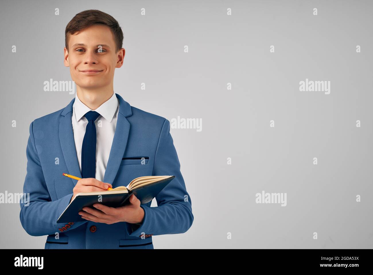 manager with notepad in hand documents work official Stock Photo - Alamy