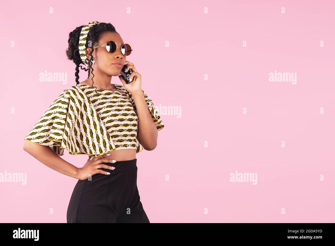 Afro american woman talking on her phone with a cool pose Stock Photo ...
