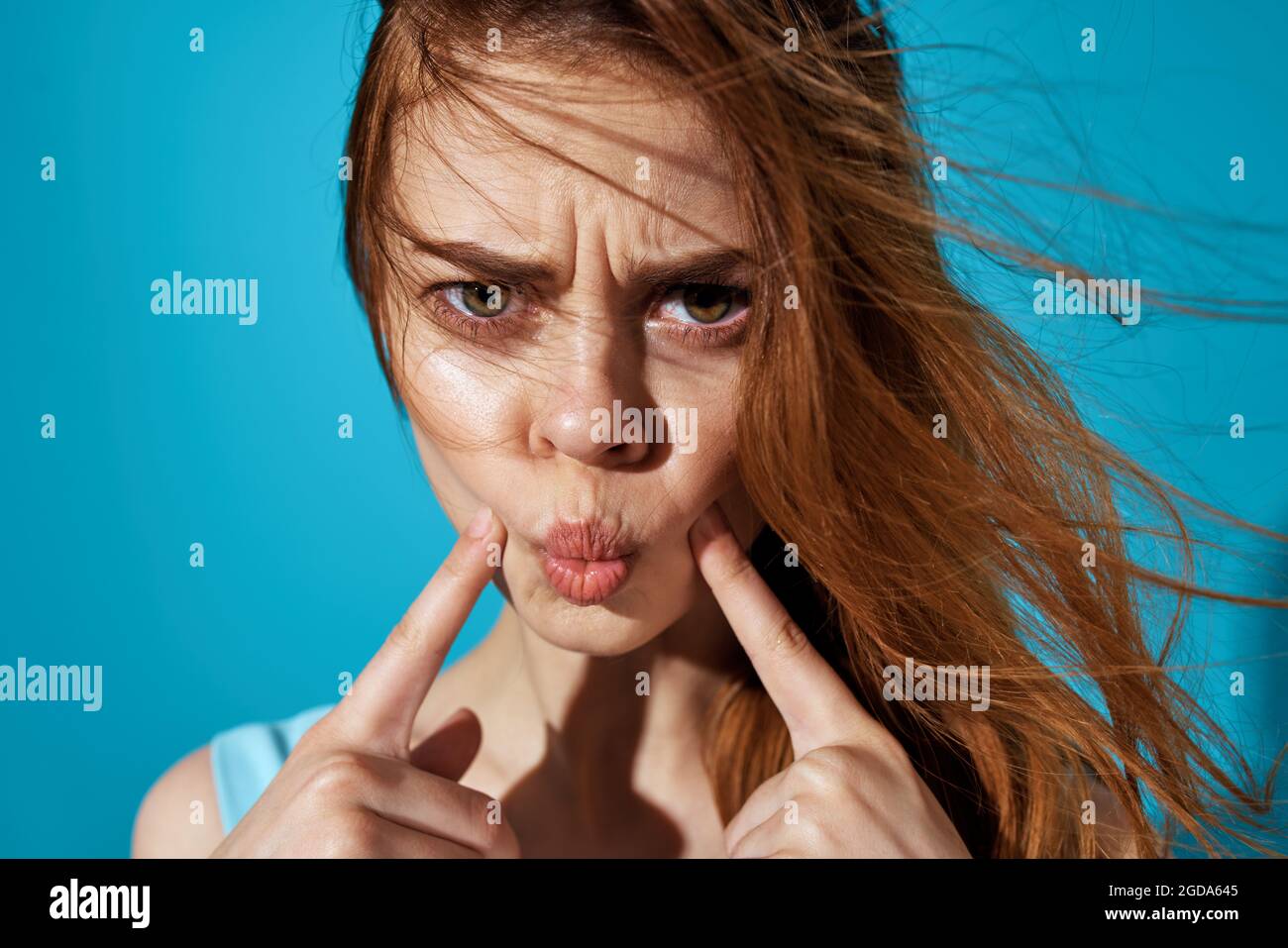 beautiful woman in a blue dress blue background Lifestyle Stock Photo ...