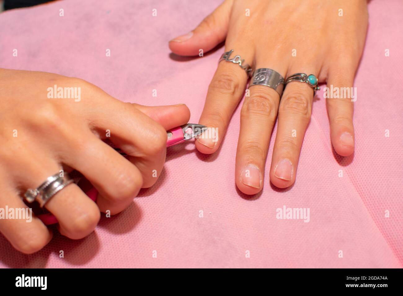 Close up of a woman applying nail polish, painting nails Stock Photo ...