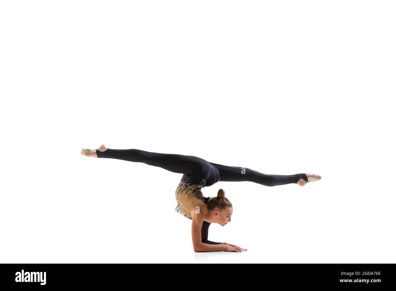 Young girl, rhythmic gymnastics artist training isolated on white ...