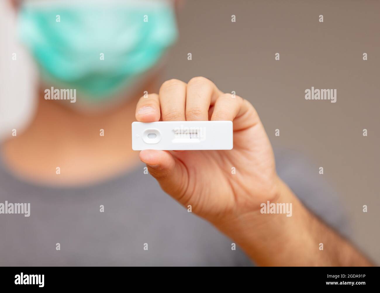 Coronavirus negative result rapid test, self testing at home, Man hand ...