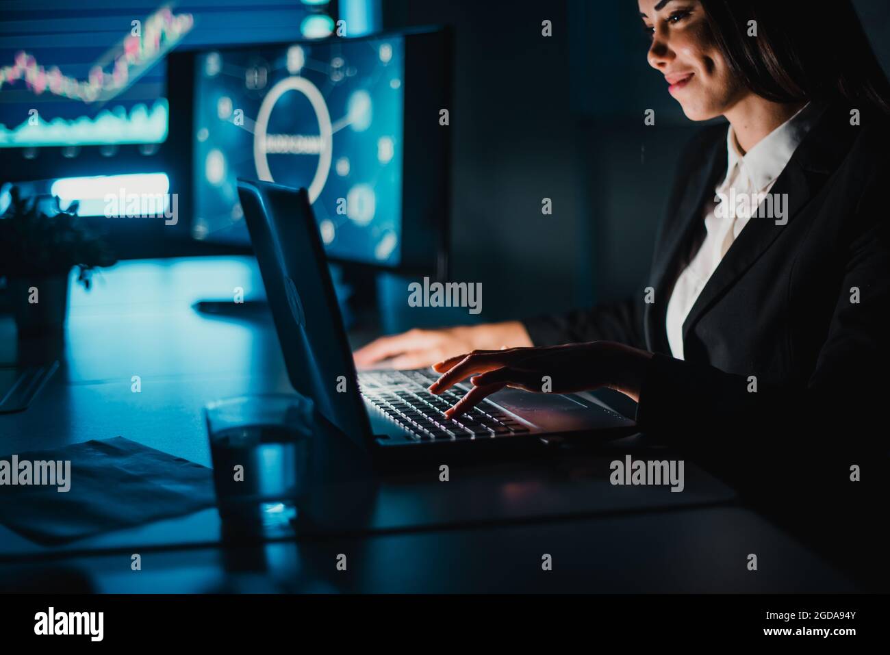 young business woman works with computer in office and uses technology ...