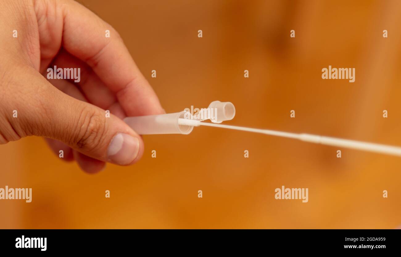Covid19 Coronavirus detection. Man performing a self test. Rapid ...