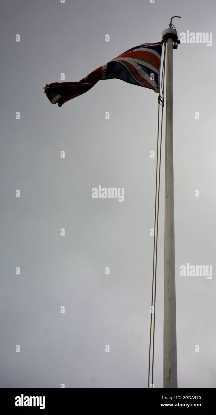 Vertical low angle shot of a waving flag of England Stock Photo - Alamy
