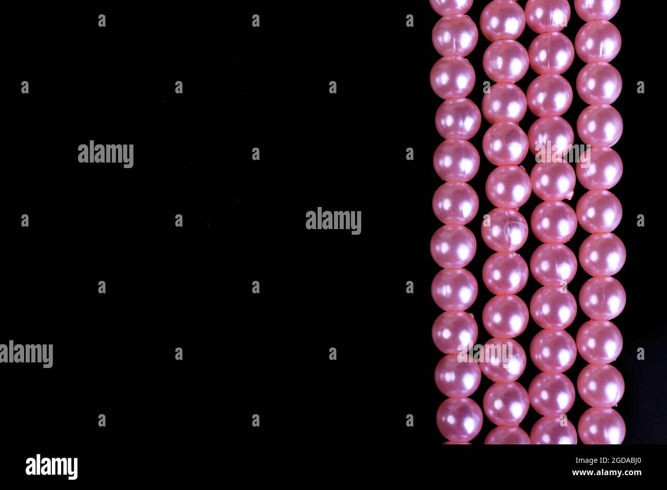 Beautiful pearls on black background Stock Photo - Alamy