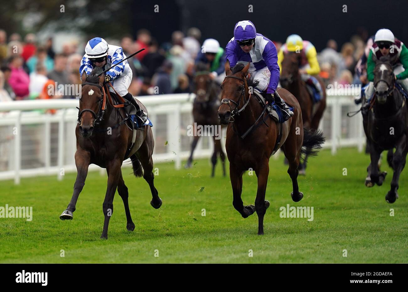 Thebeautifulgame ridden by jockey Laura Pearson (left) on their way to ...