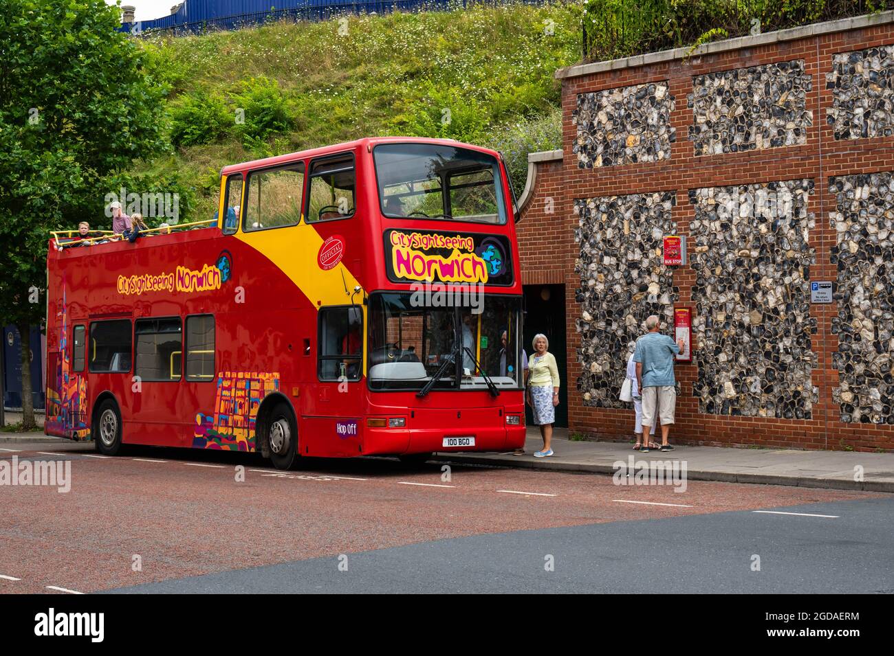Open top sightseeing red bus with passengers about to get on at Castle ...