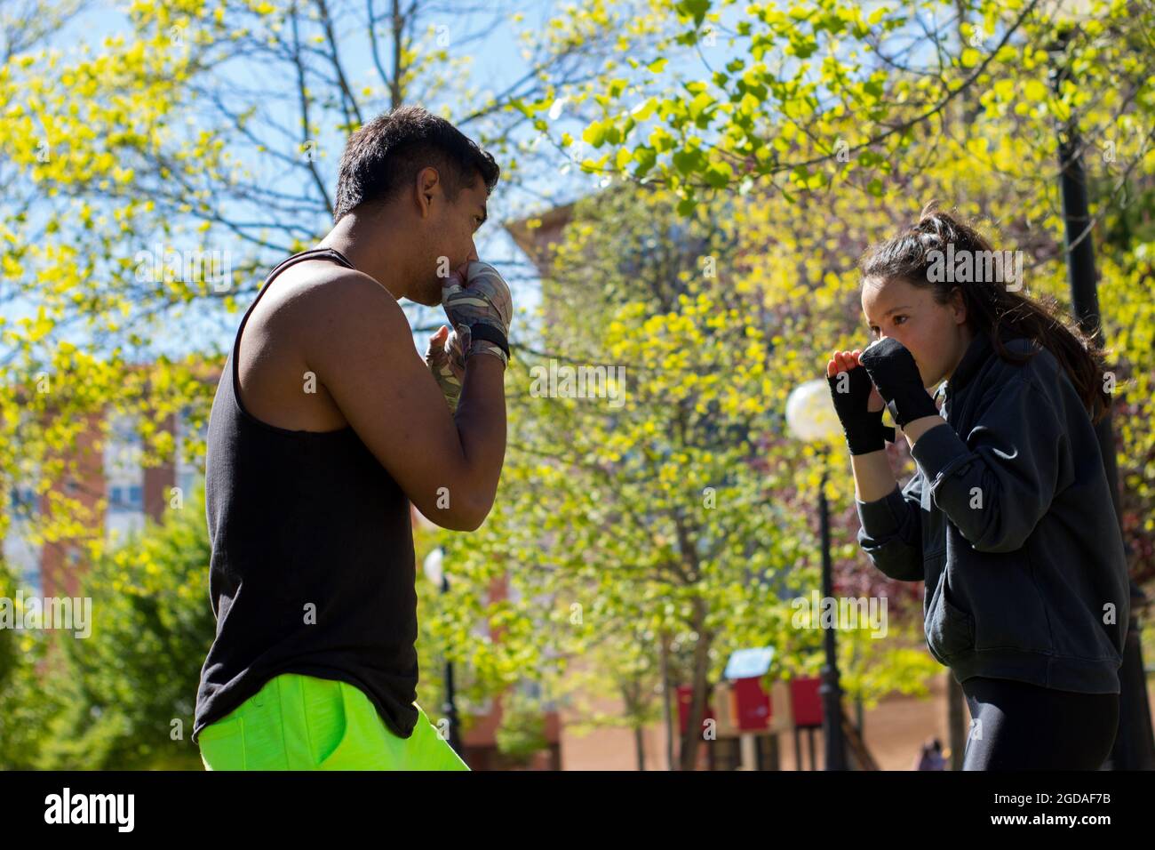 Athlete couple practicing for boxing in the park Stock Photo - Alamy