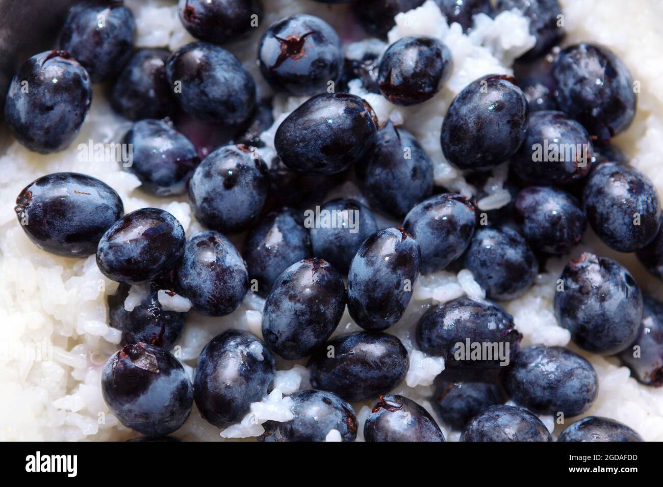 Rice with grapes in the plate . Porridge for healthy breakfast Stock ...