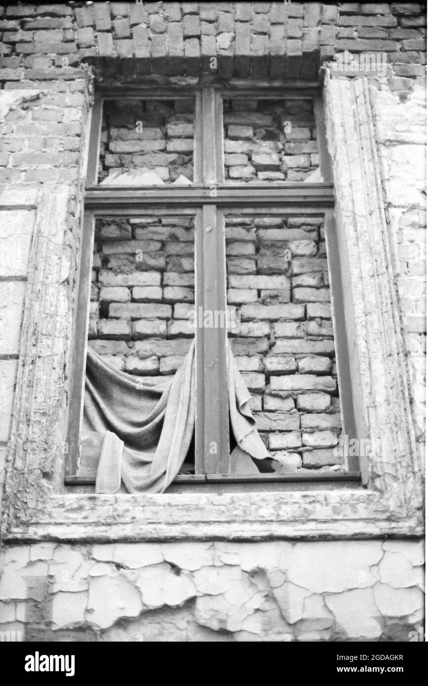 21 March 1978, Berlin: A bricked-up window in the basement of a ...
