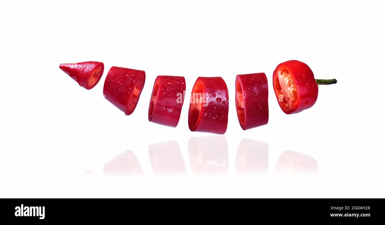flying red pepper on white background Stock Photo - Alamy