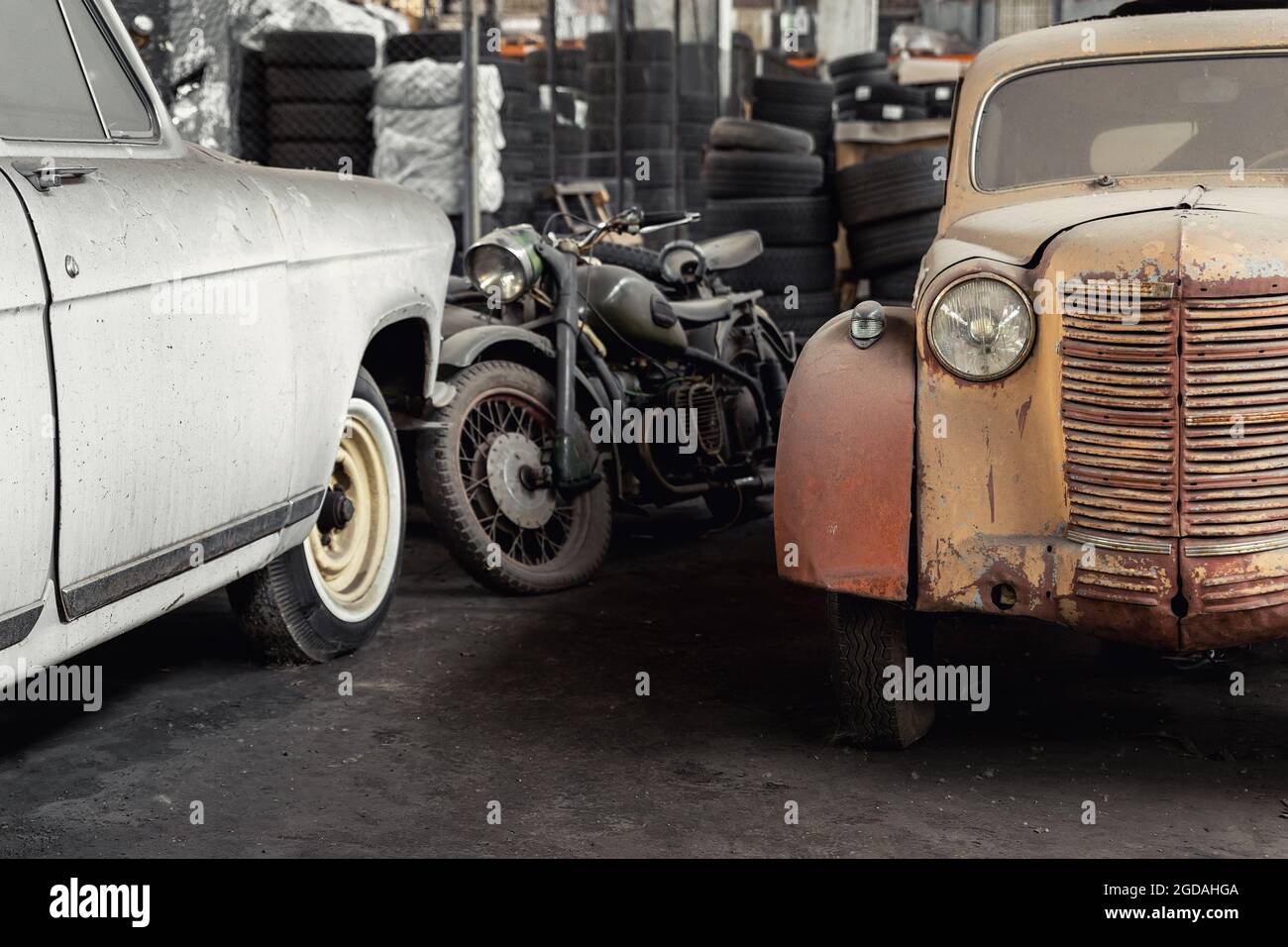 Many rusty abandoned forgotten antique oldtimer old car and motorcycles ...