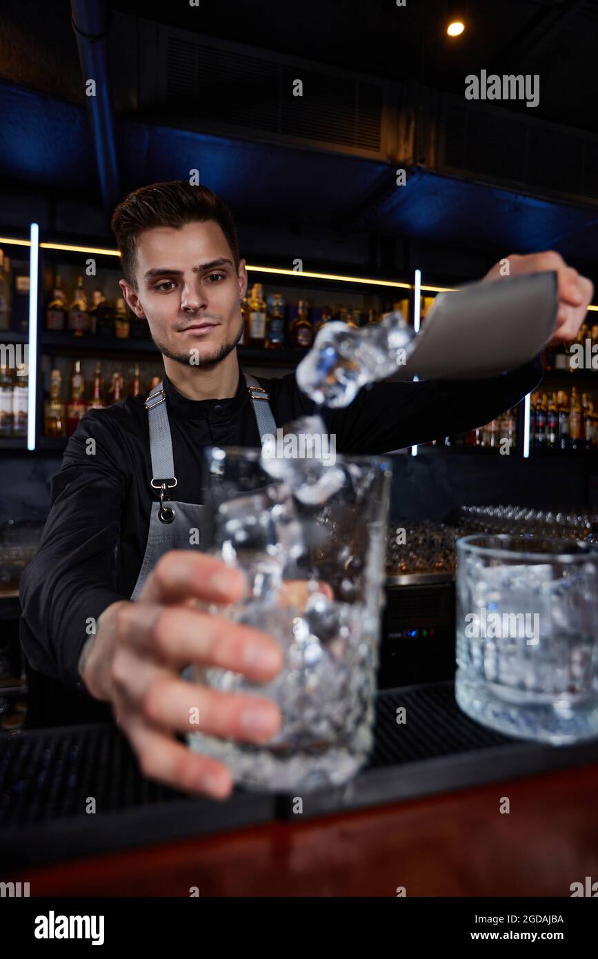 Barman holds up bar hi-res stock photography and images - Alamy