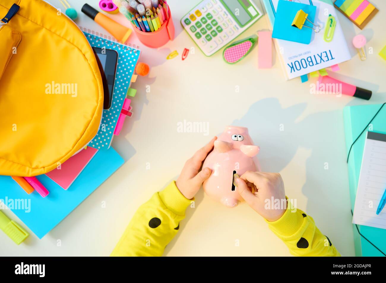 Back to school. Upper view of modern child with workbooks, stationary ...