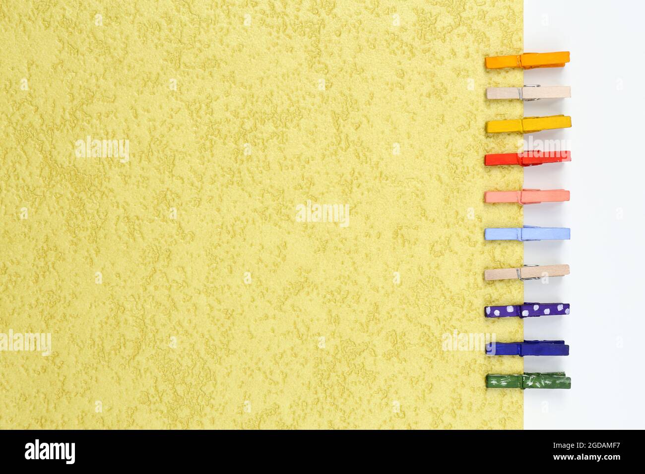 Abstract background with colorful wooden pins and paper Stock Photo - Alamy