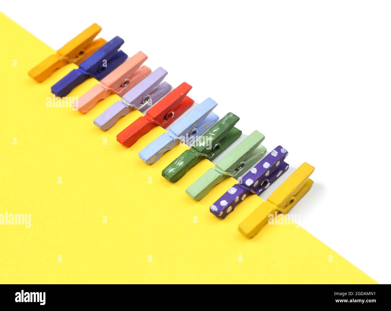 Abstract background with colorful wooden pins and paper Stock Photo - Alamy