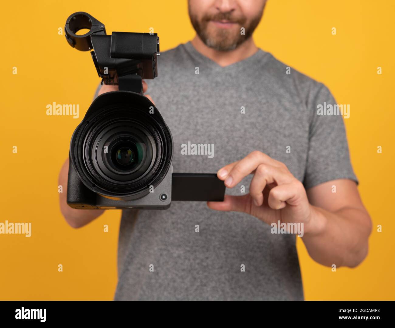 lens of camcorder. cropped man with camcorder. videographer making ...