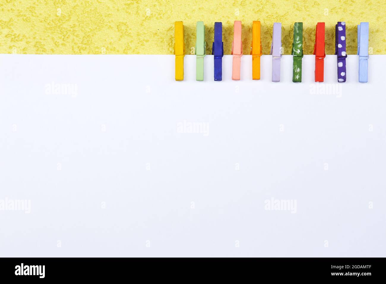 Abstract background with colorful wooden pins and paper Stock Photo - Alamy