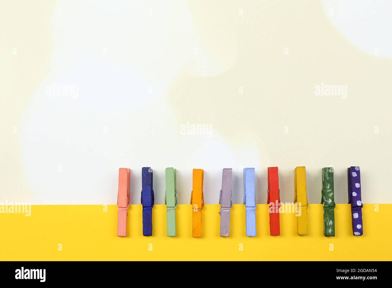Abstract background with colorful wooden pins and paper Stock Photo - Alamy