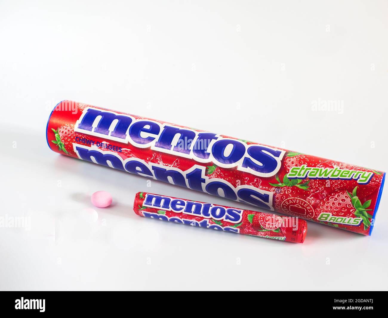 In this photo illustration packs of Mentos, strawberry chewy dragees ...