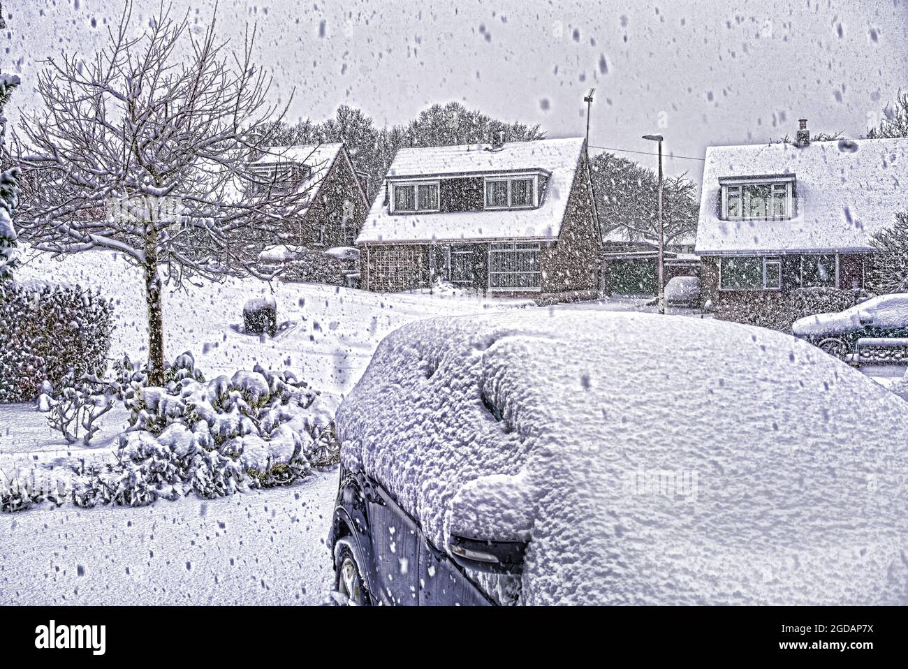 Digitally enhanced, manipulated, Snowy scene in housing estate, heavy ...