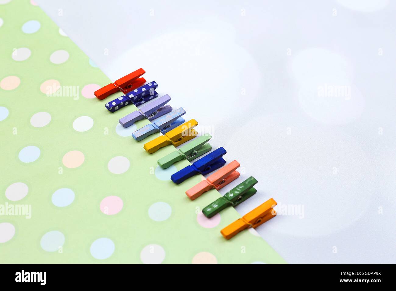 Abstract background with colorful wooden pins and paper Stock Photo - Alamy