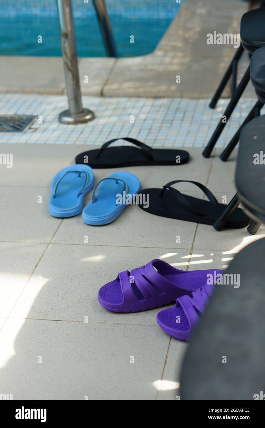 POZNAN, POLAND - May 22, 2015: A vertical shot of slippers on tiles in ...