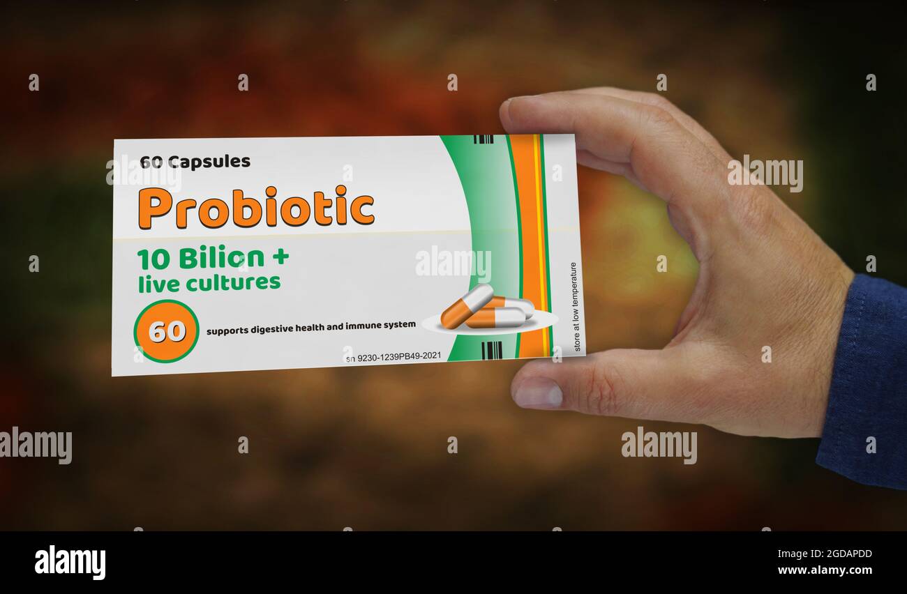 Probiotic pack production. Medical antibiotic therapy drug box in hand ...
