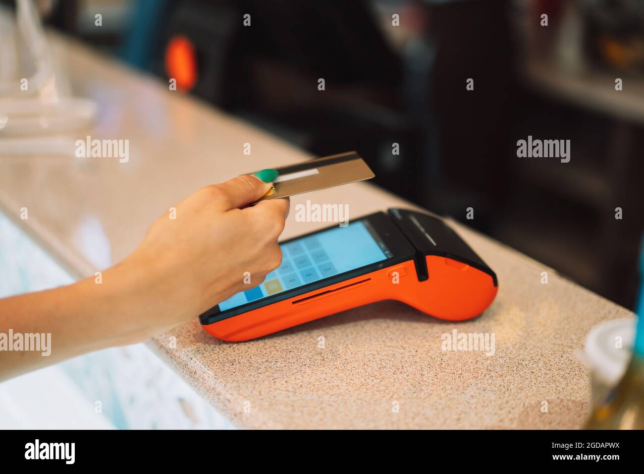 Contactless payment from card via pos terminal Stock Photo - Alamy