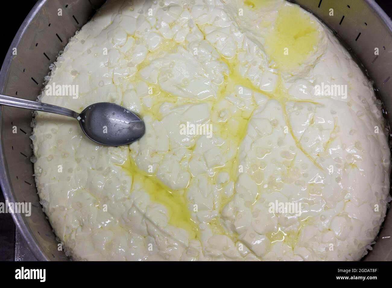 phases of Greek feta cheese production in a cheese factory in Greece ...