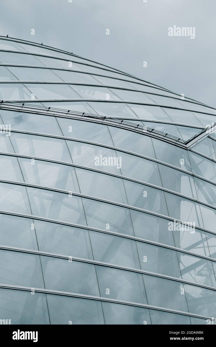 Low-angle shot of a modern building with a glass facade Stock Photo - Alamy