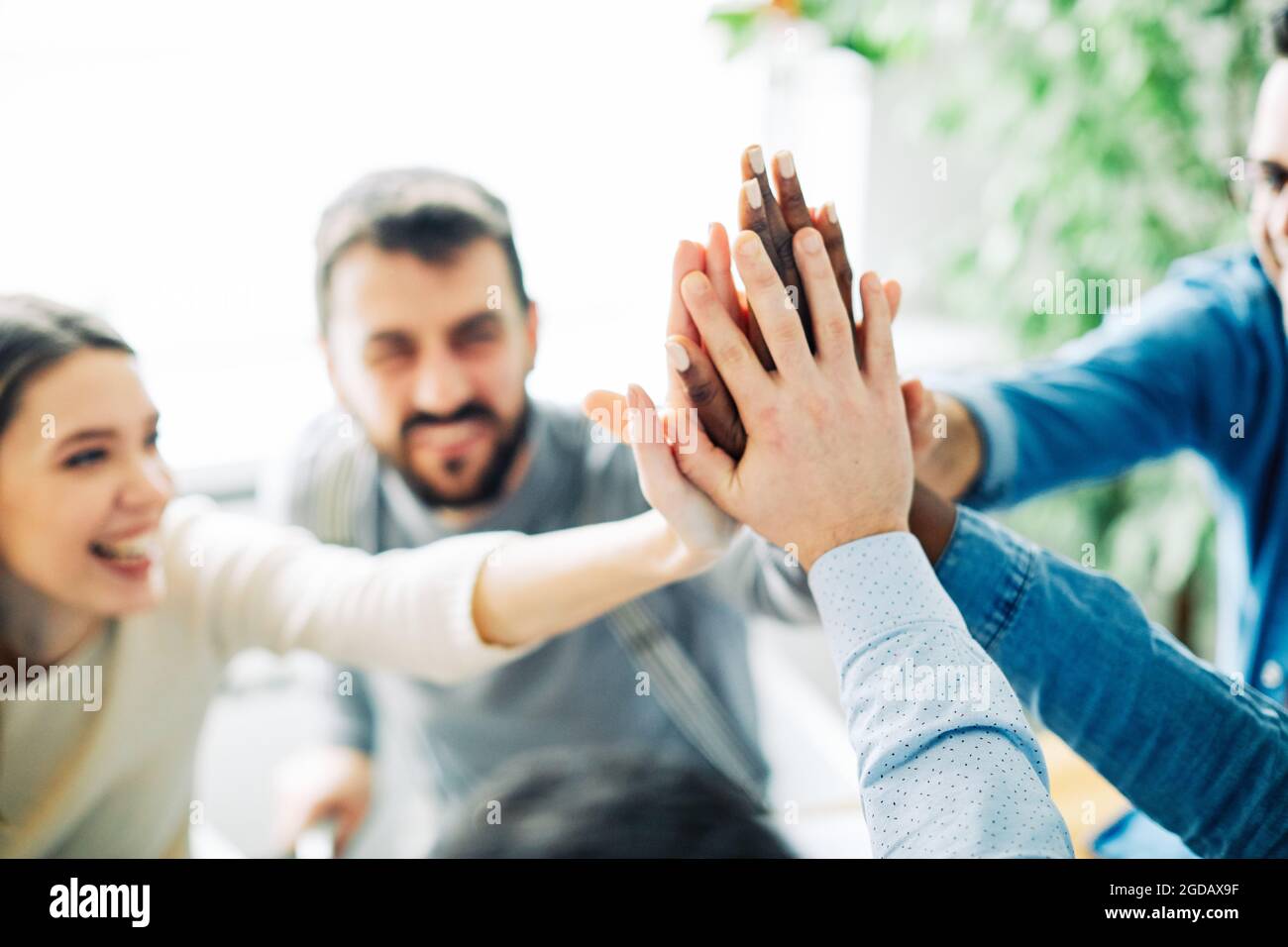 business people team high five support unity celebrating give me five ...