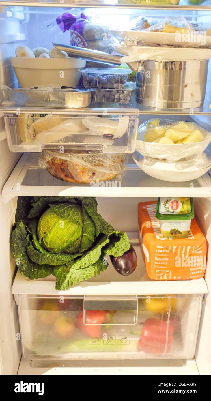 The contents of a very messy fridge Stock Photo - Alamy