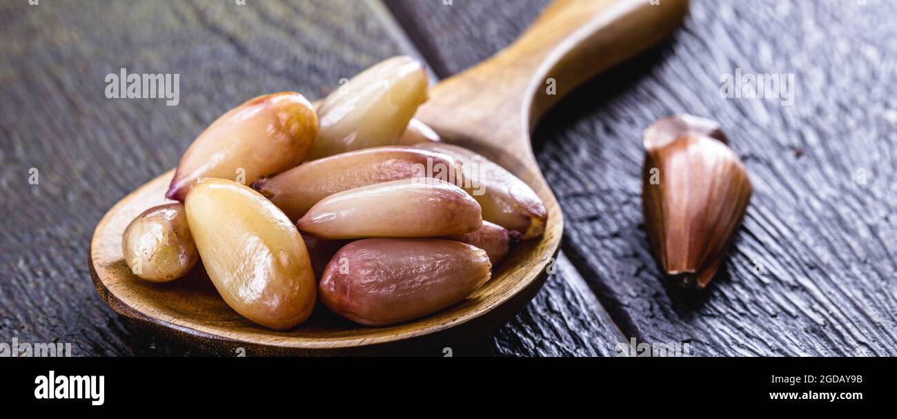 spoon with cooked pinhão seeds, a typical culinary ingredient from ...